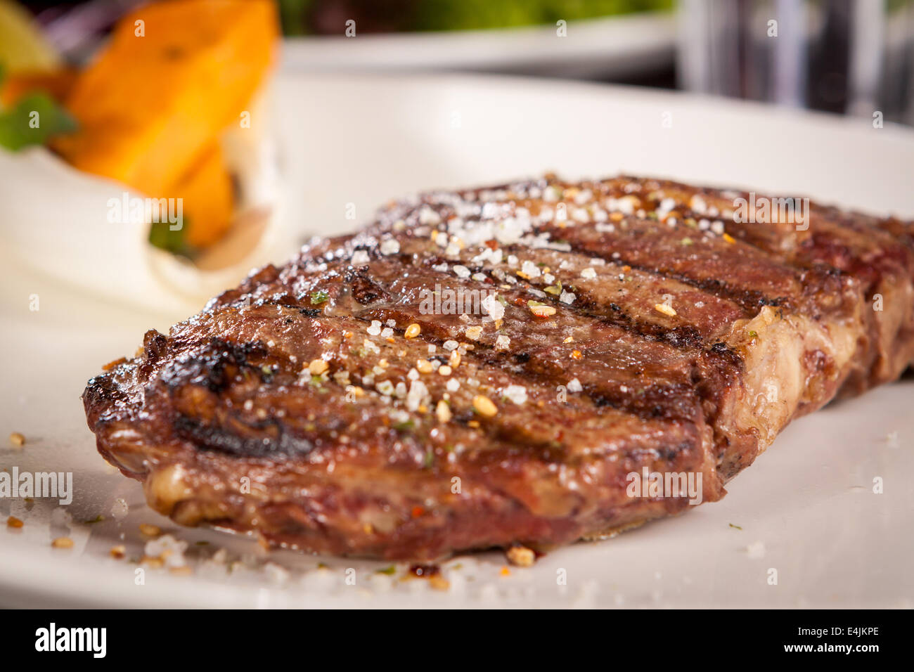 Delicious trimmed lean portion of thick grilled beef steak with ...