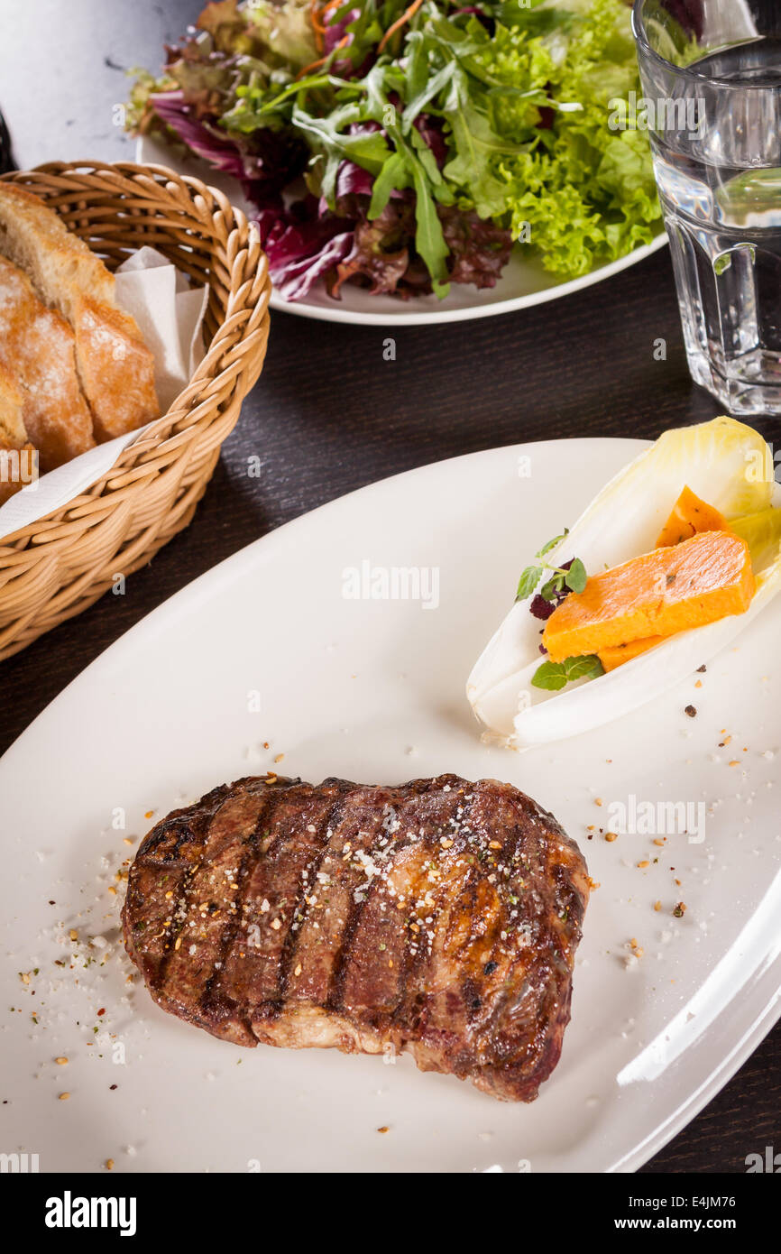 Delicious trimmed lean portion of thick grilled beef steak with ...
