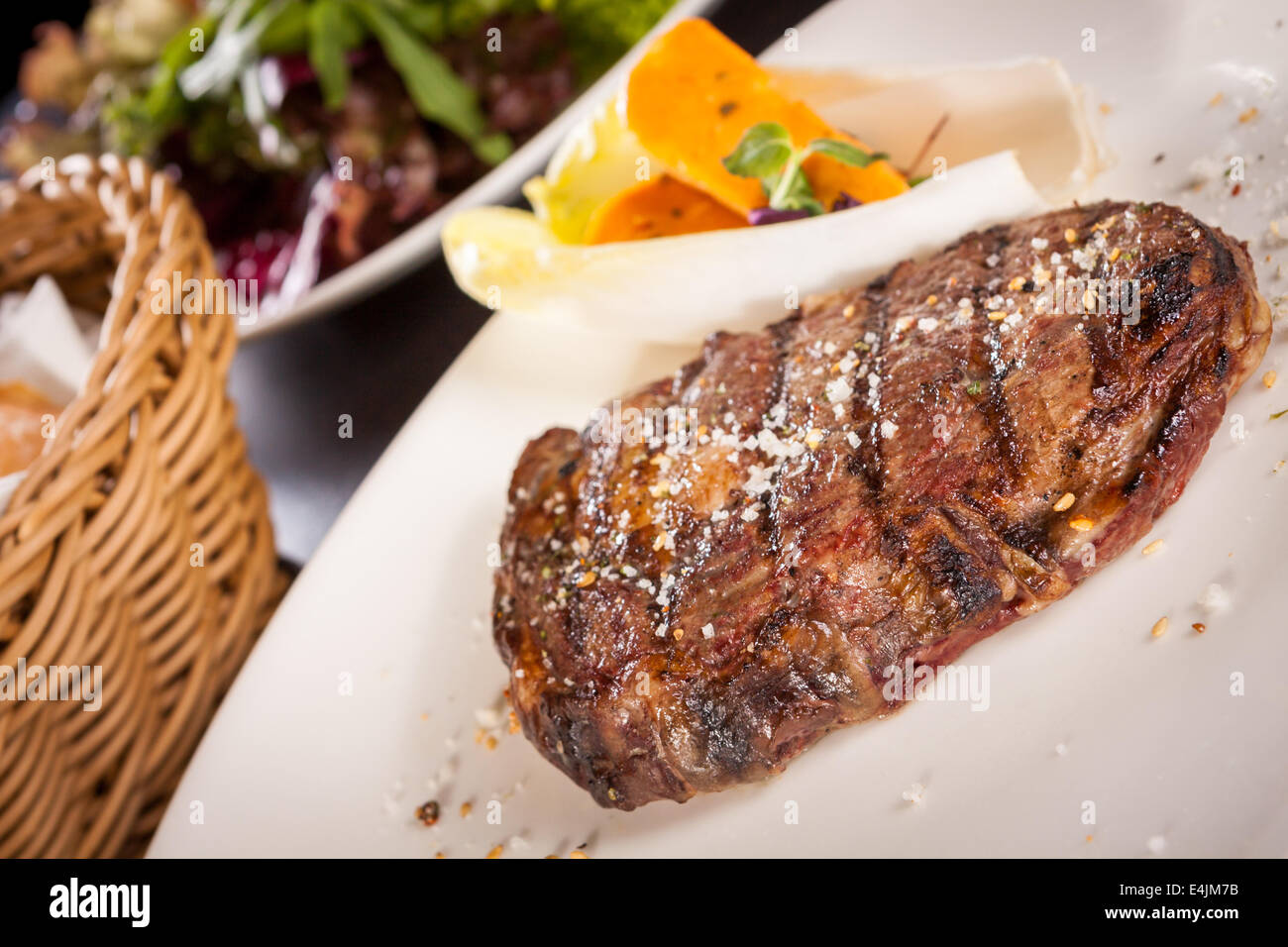 Delicious trimmed lean portion of thick grilled beef steak with ...