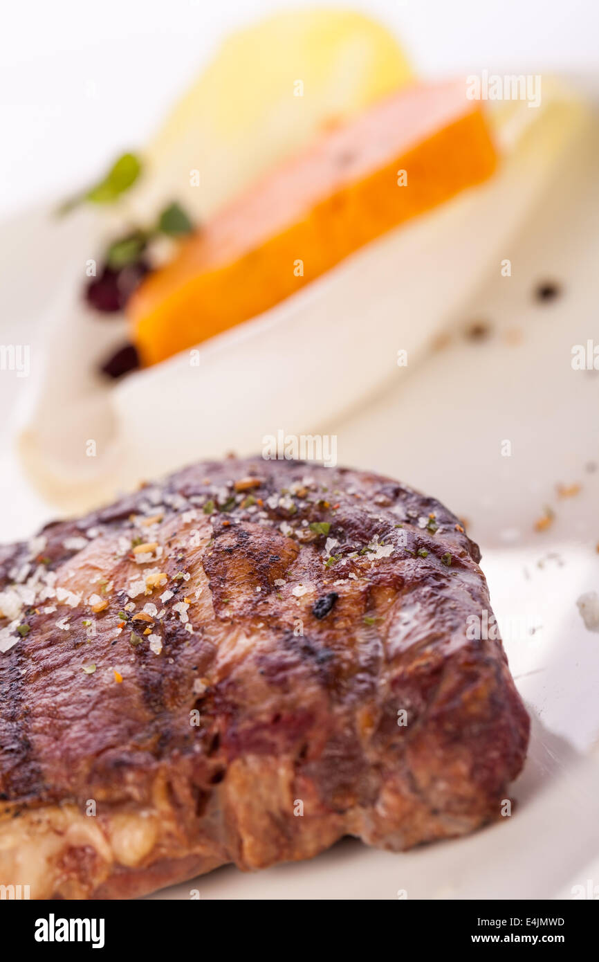 Delicious trimmed lean portion of thick grilled beef steak with ...