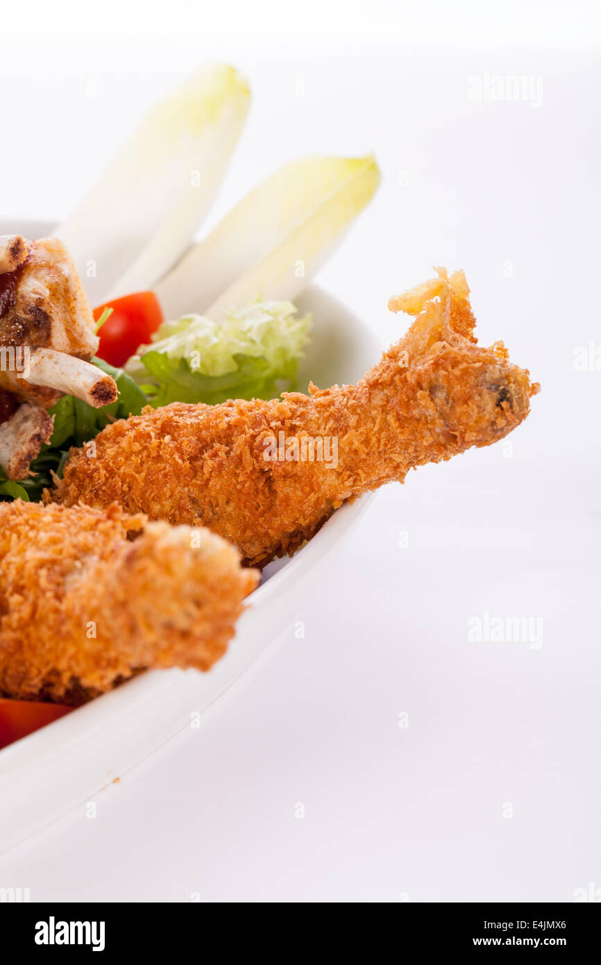 Wholesome platter of mixed meats including grilled steak, crispy ...
