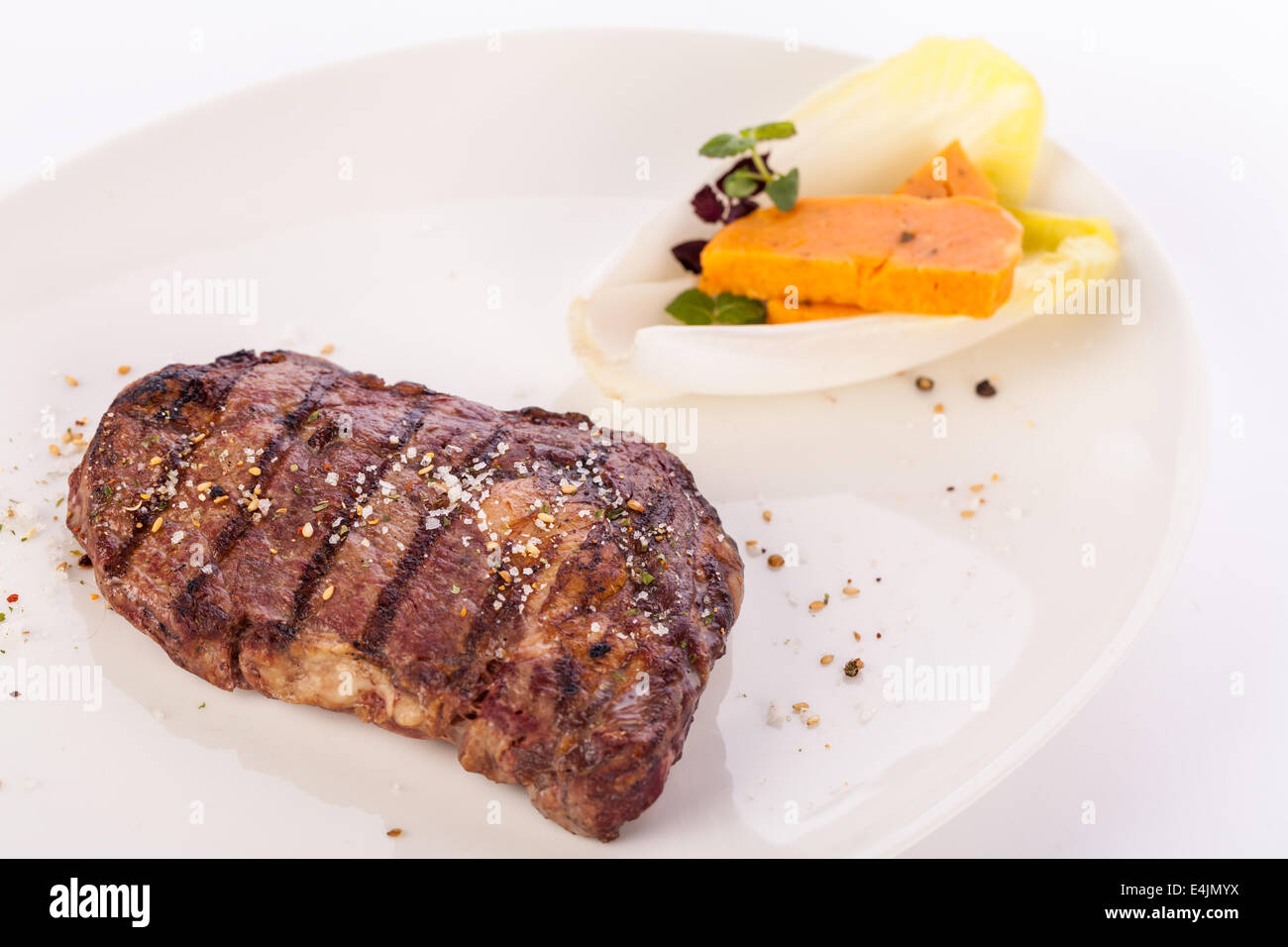Delicious trimmed lean portion of thick grilled beef steak with ...