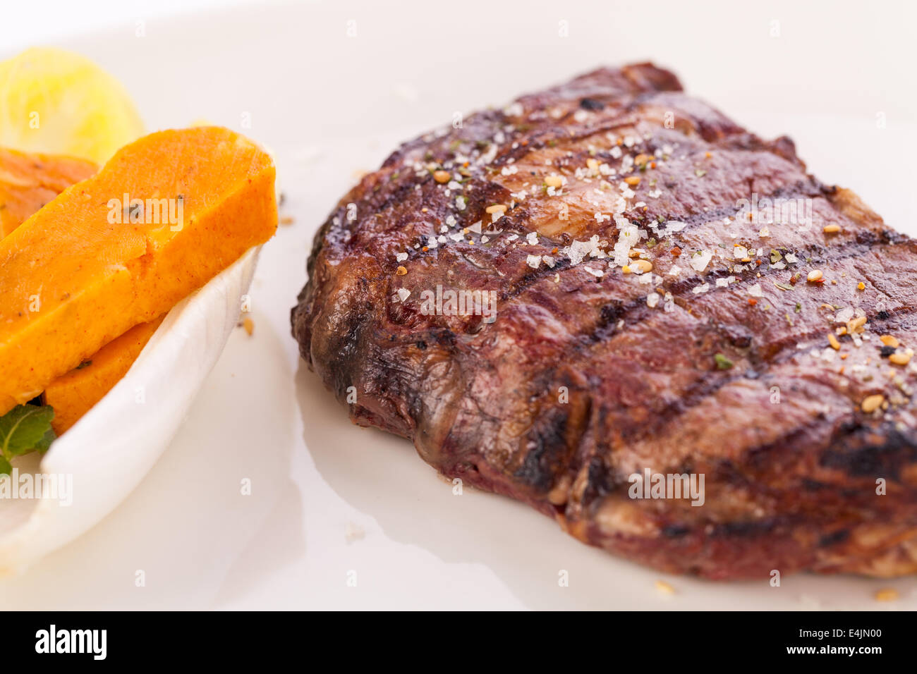 Delicious trimmed lean portion of thick grilled beef steak with ...