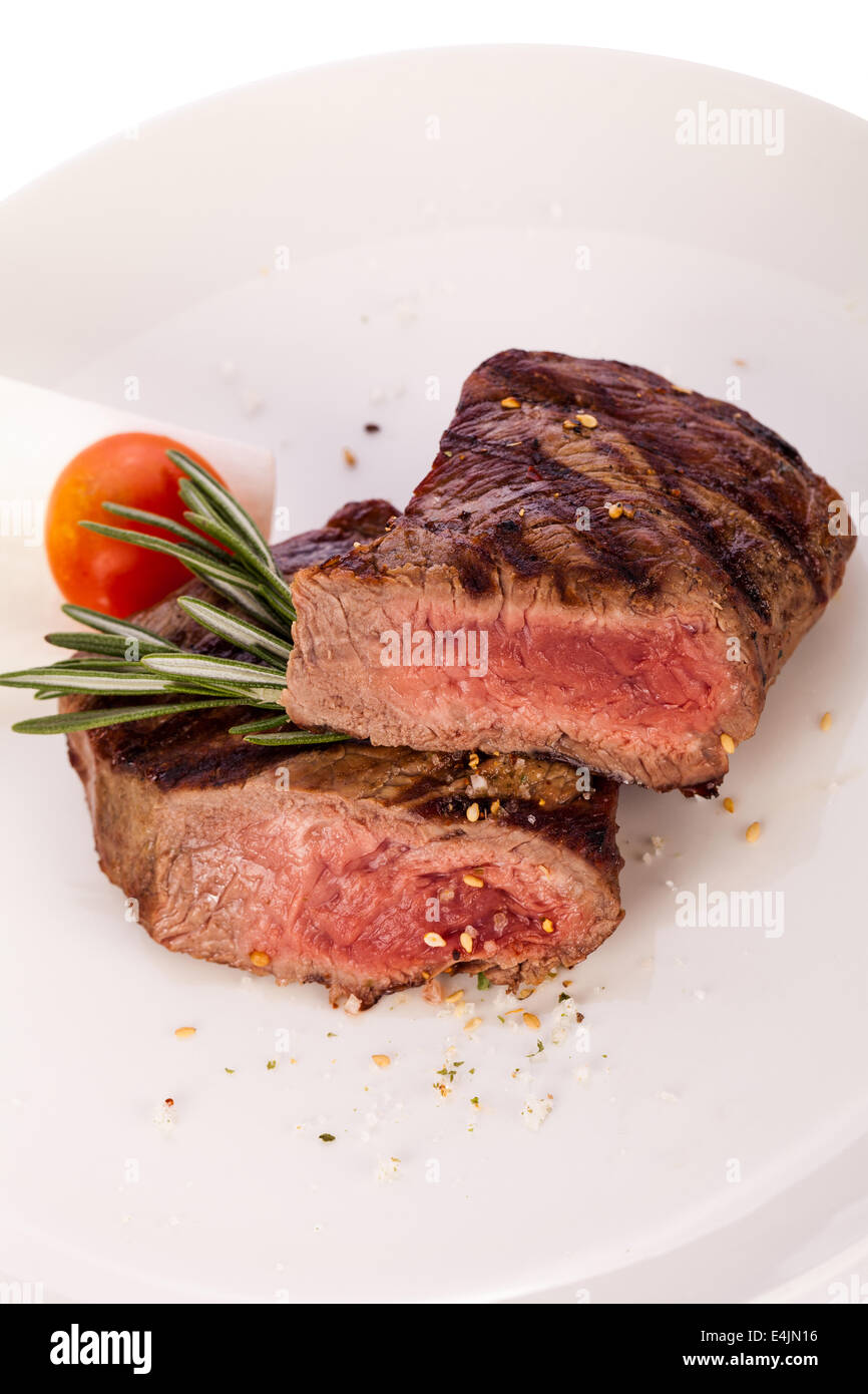 Succulent medium rare beef steak sliced through to display the tender ...