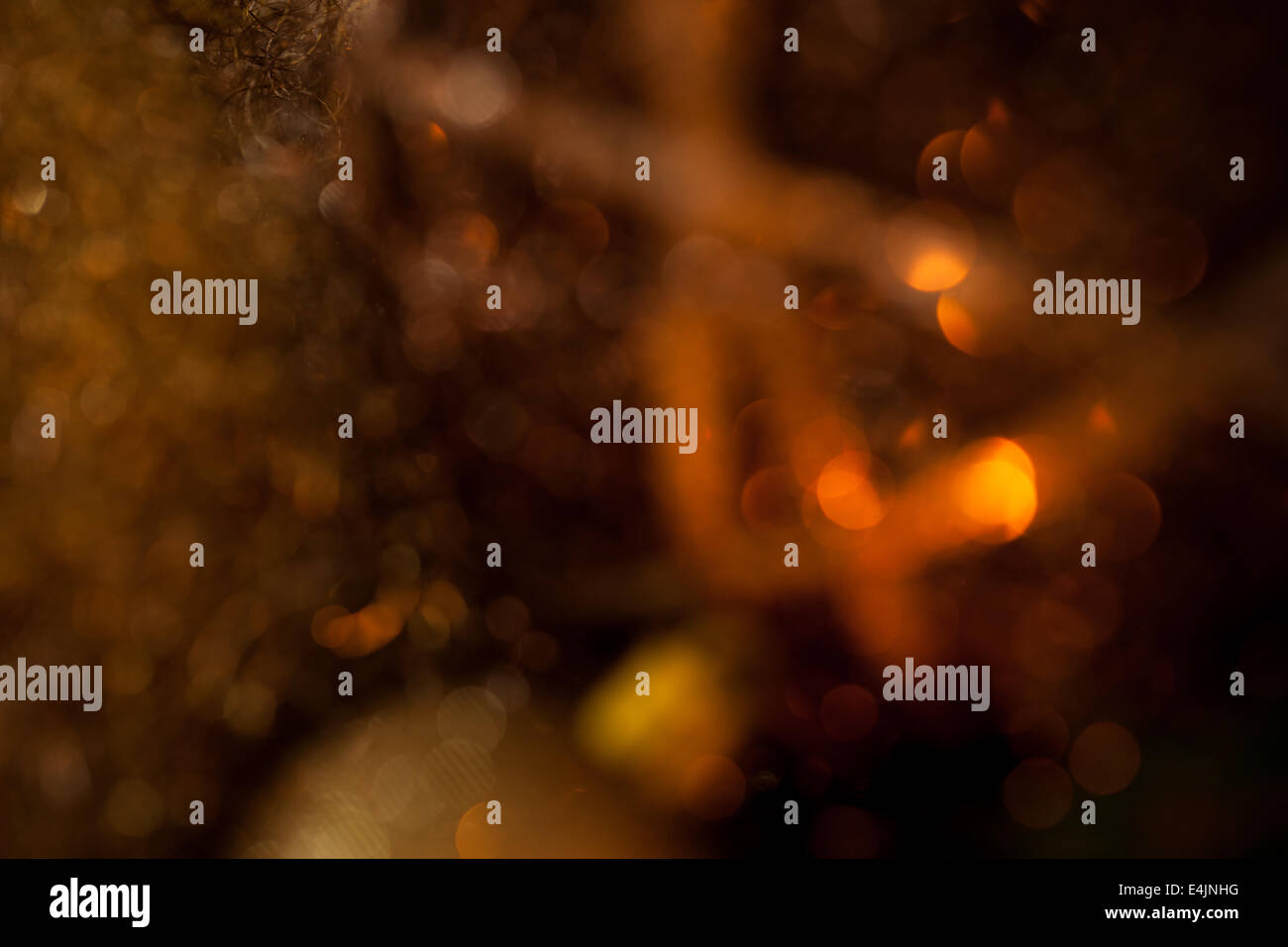 Warm gold and red Christmas candlelight background with burning tea ...