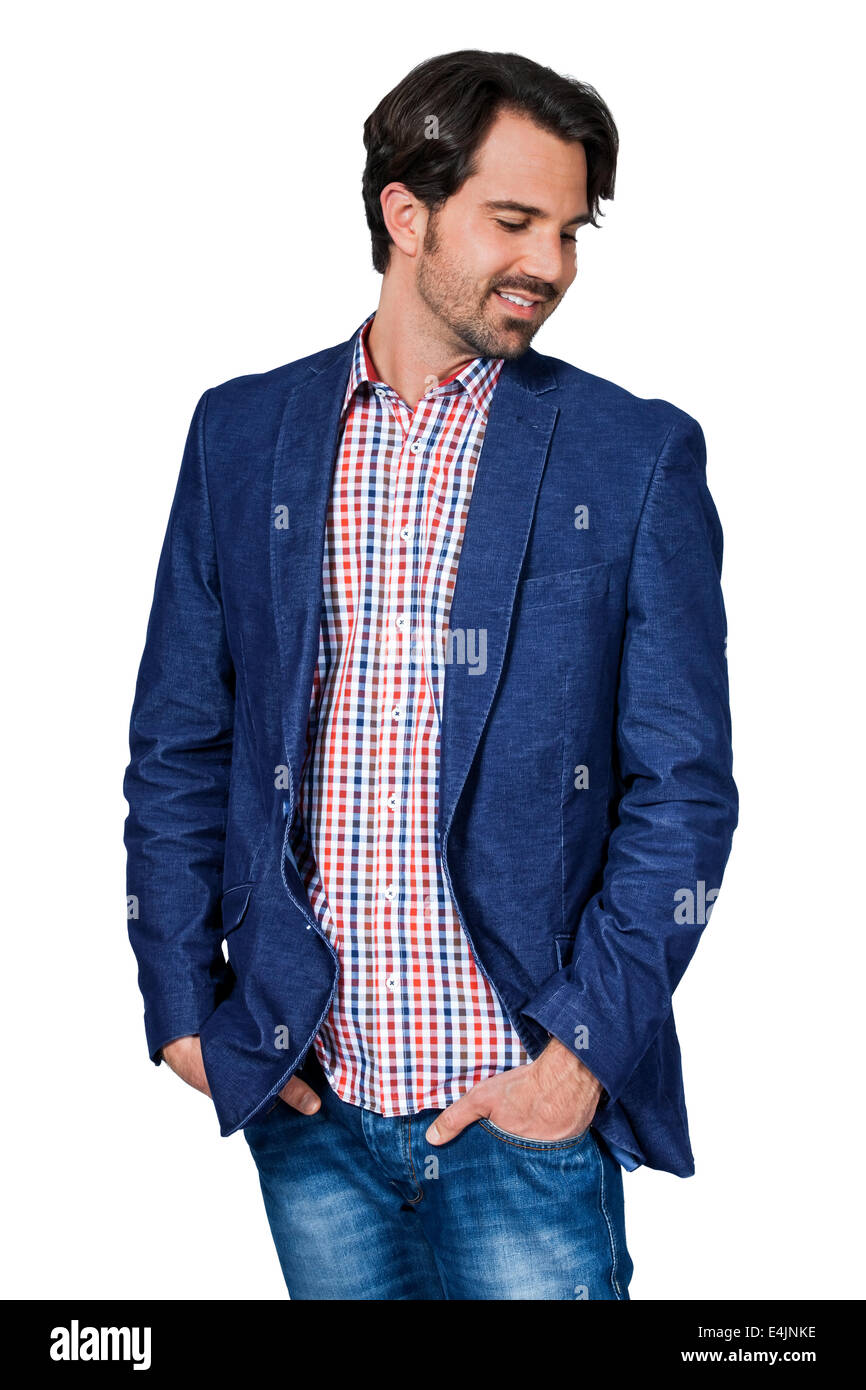 Handsome smiling man in stylish leisurewear approaching the camera in a ...