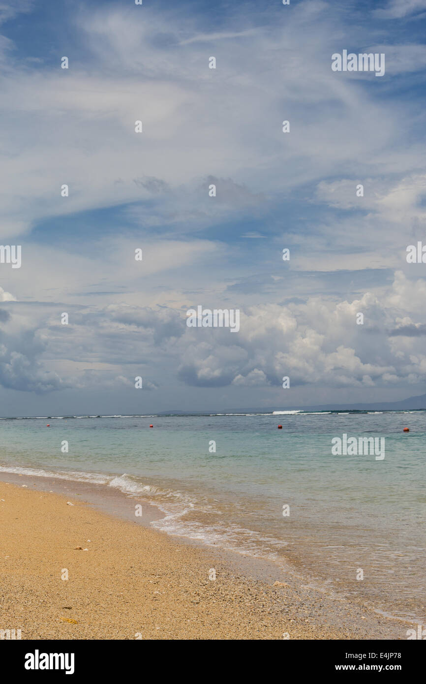 Beautiful tropical beach with lush vegetation fringing golden sand and ...