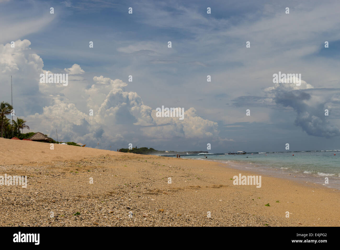 Beautiful tropical beach with lush vegetation fringing golden sand and ...