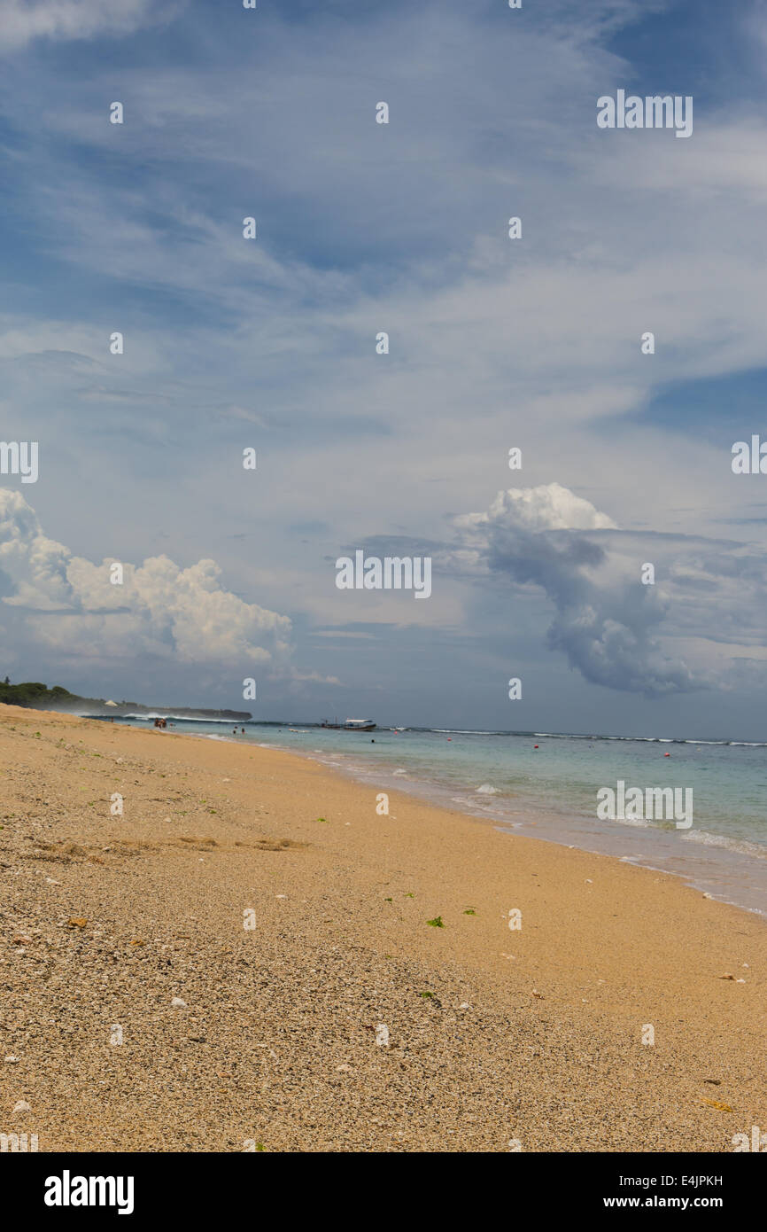 Beautiful tropical beach with lush vegetation fringing golden sand and ...