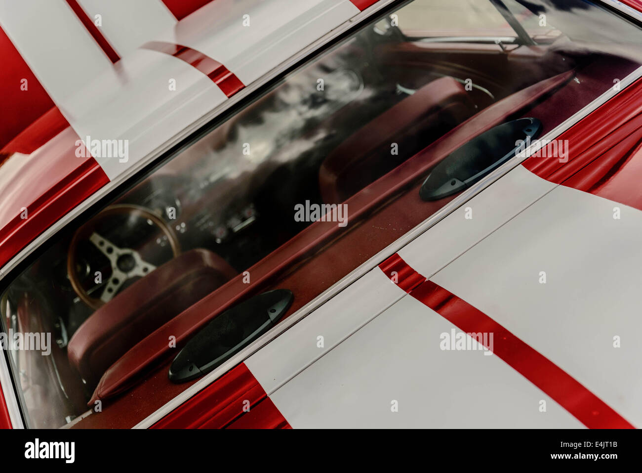 1960's restored red Ford Mustang with white racing stripes Stock Photo ...