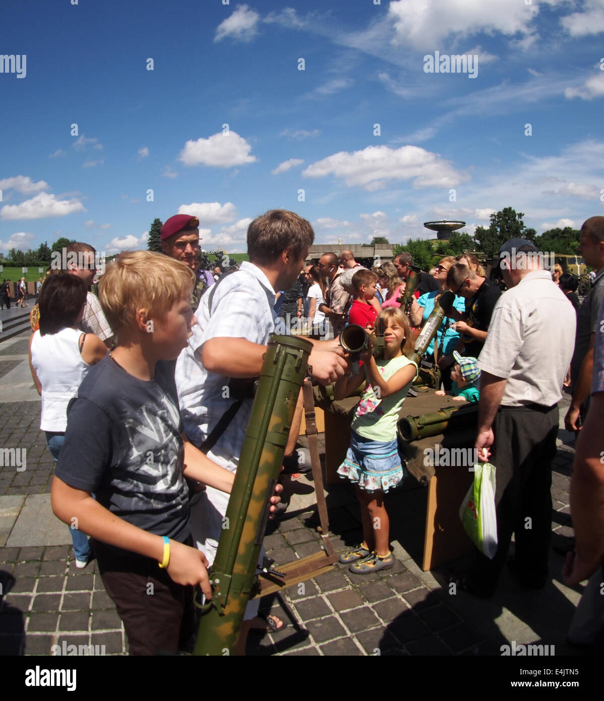 Kyiv, Ukraine. 13th July, 2014. Visitors examine shoulder held Russian ...