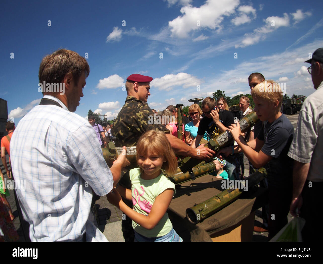 Kyiv, Ukraine. 13th July, 2014. Visitors examine shoulder held Russian ...
