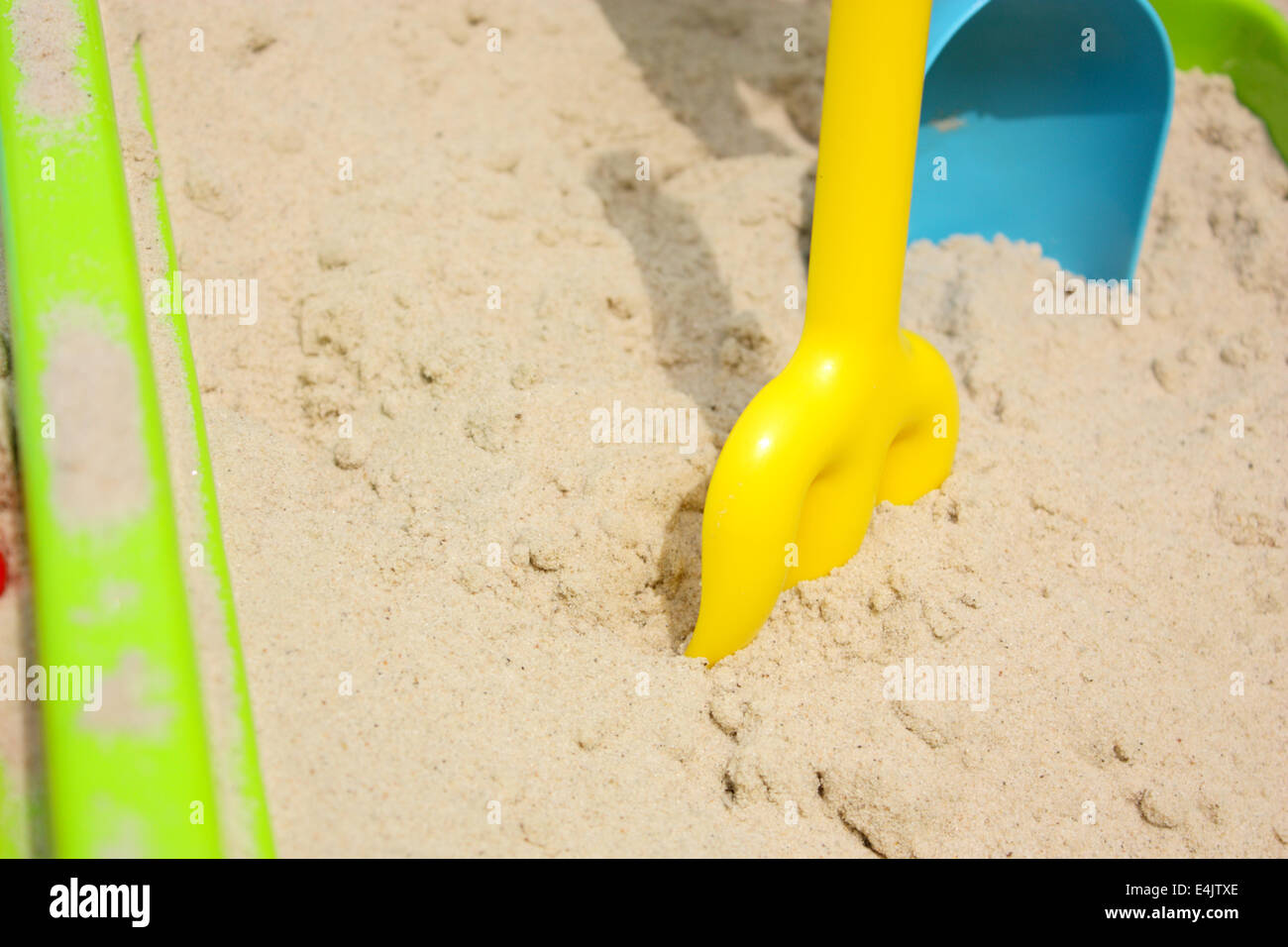 An image showing the concept of summer fun in the sand with a spade and ...