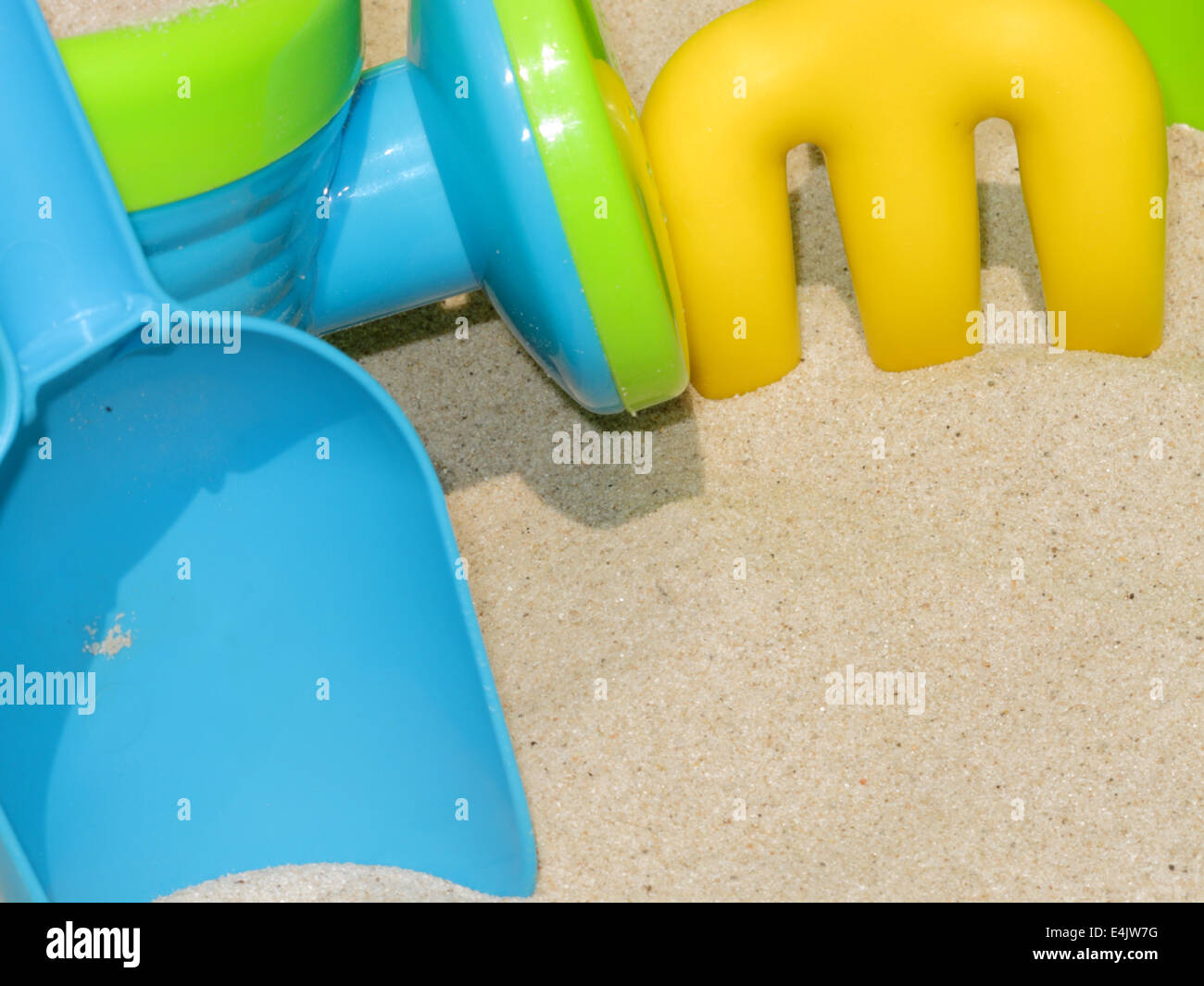An image showing the concept of summer fun in the sand with a spade, a ...