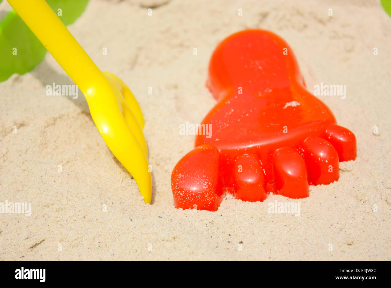 An image showing the concept of summer fun in the sand with a foot ...