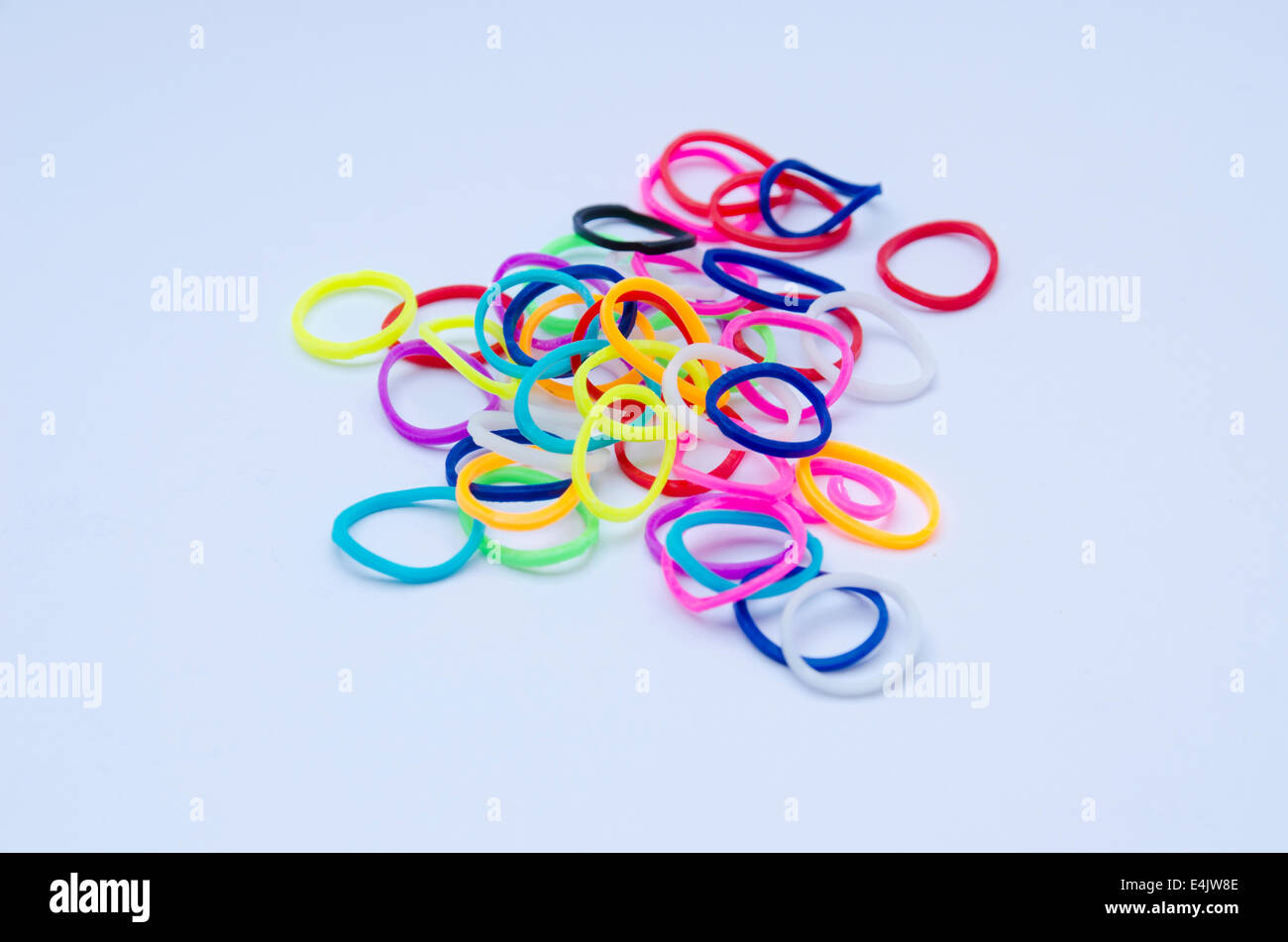 Loom bands on white background Stock Photo - Alamy
