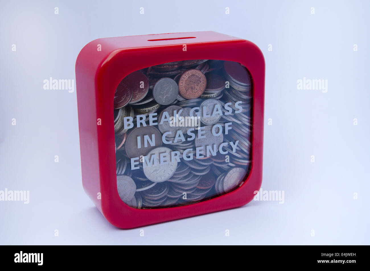 British coins in novelty piggy bank on white background Stock Photo - Alamy