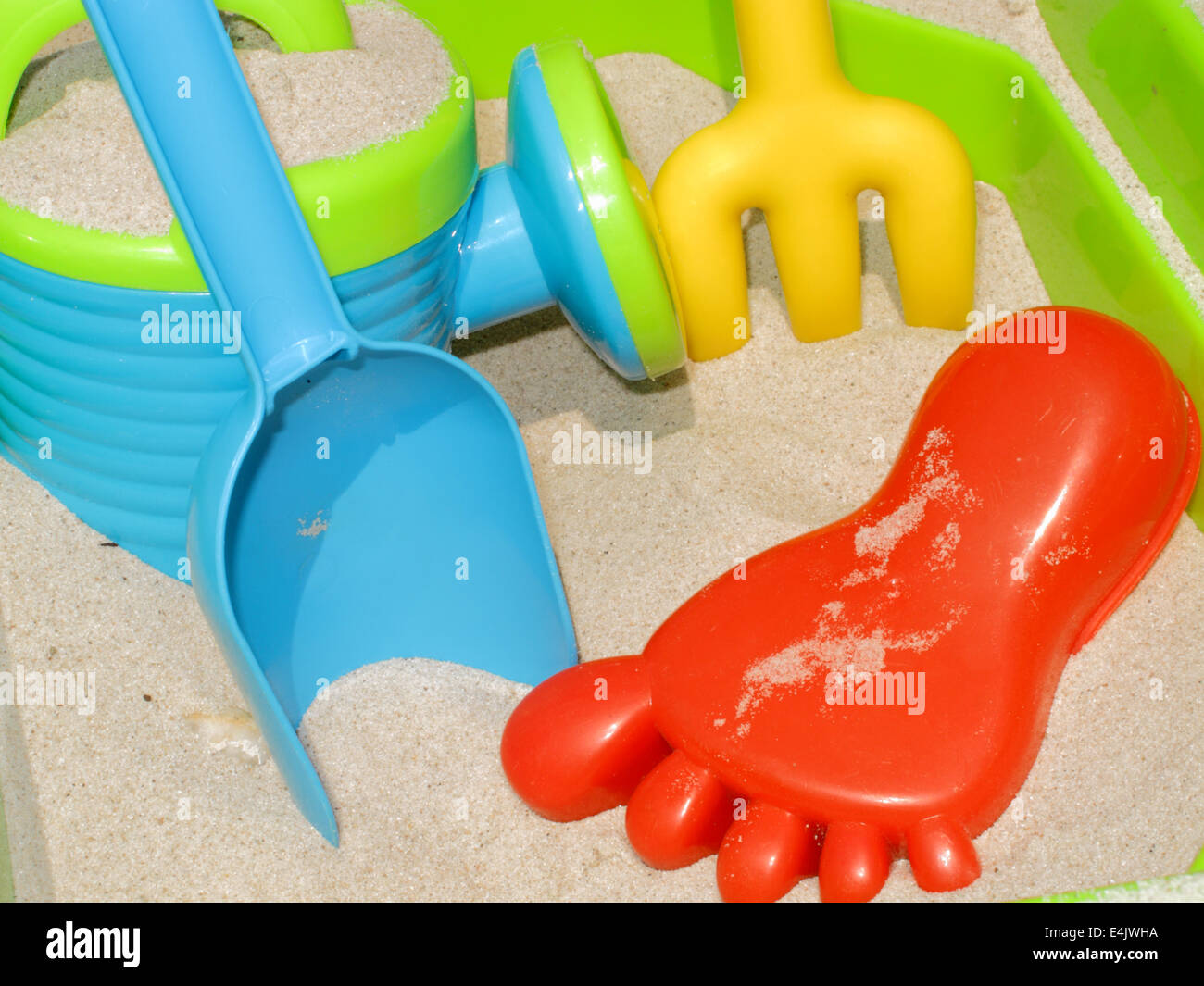 An image showing the concept of summer fun in the sand with a spade, a ...