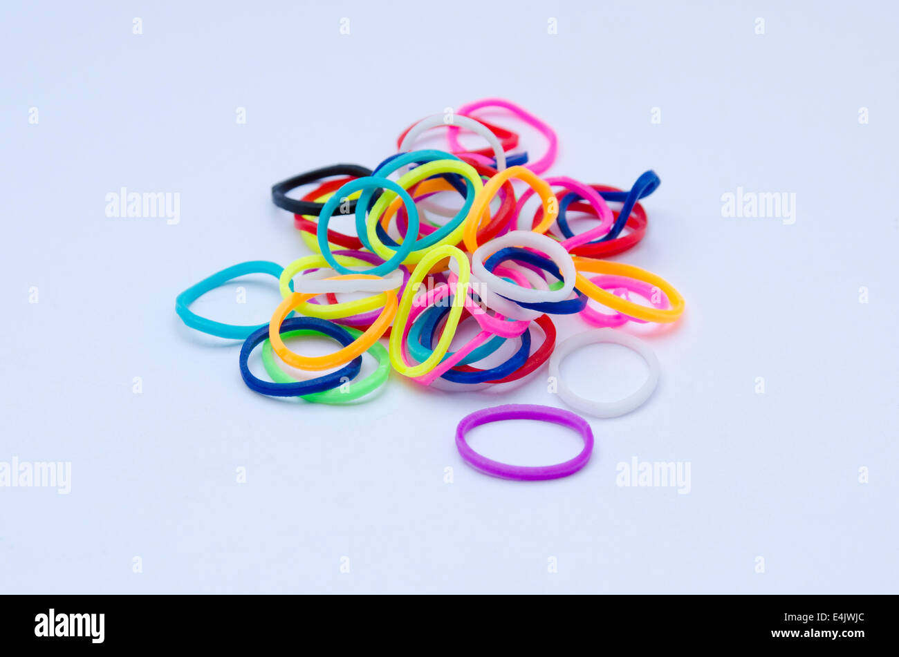 Loom bands on white background Stock Photo - Alamy