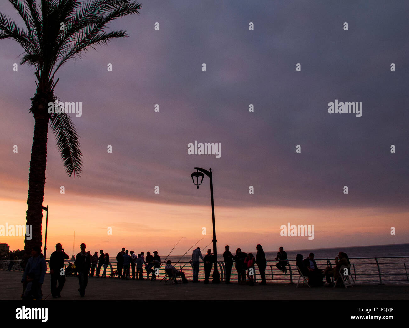 The Corniche at sunset in Beirut with people walking and fishing Stock ...