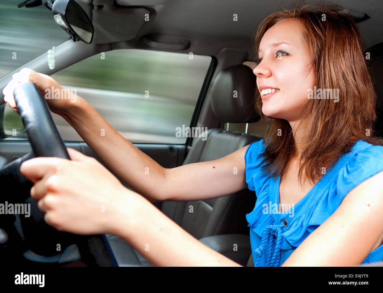 Student girl driving a car Stock Photo - Alamy