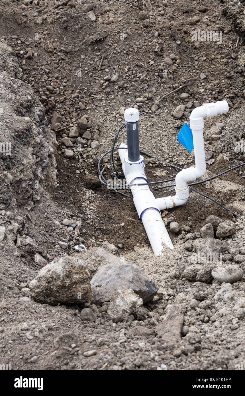 Open construction ditch with water pipe and valve Stock Photo - Alamy