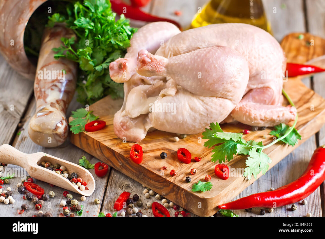 Raw chicken with spices and cilantro ready to be prepared Stock Photo ...