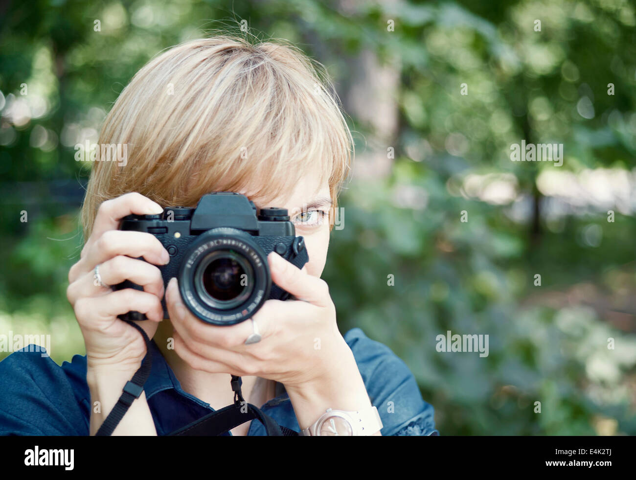 Female photographer with camera Stock Photo - Alamy