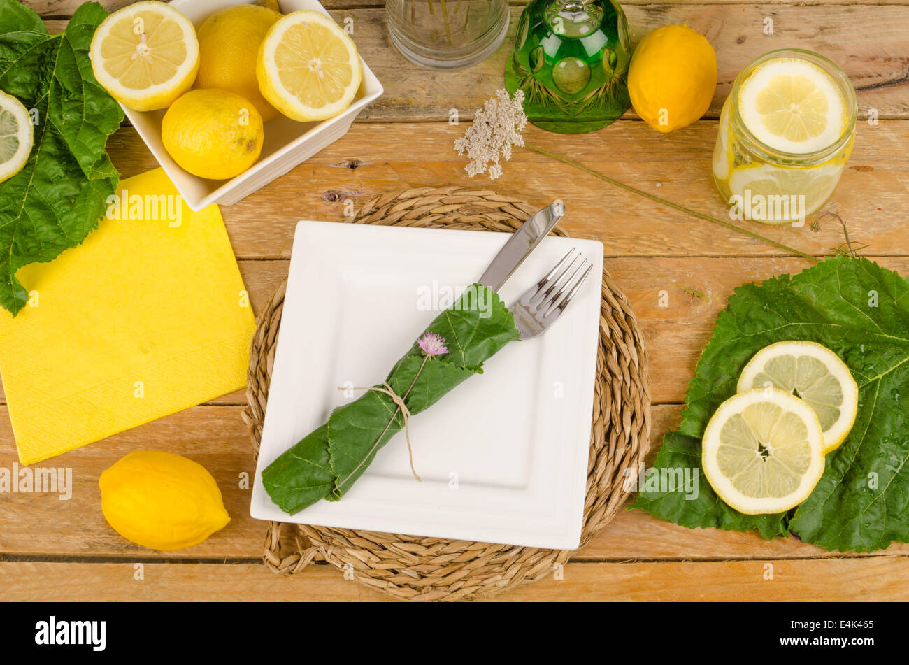 Still life of a rustic table set up in summery colors Stock Photo - Alamy