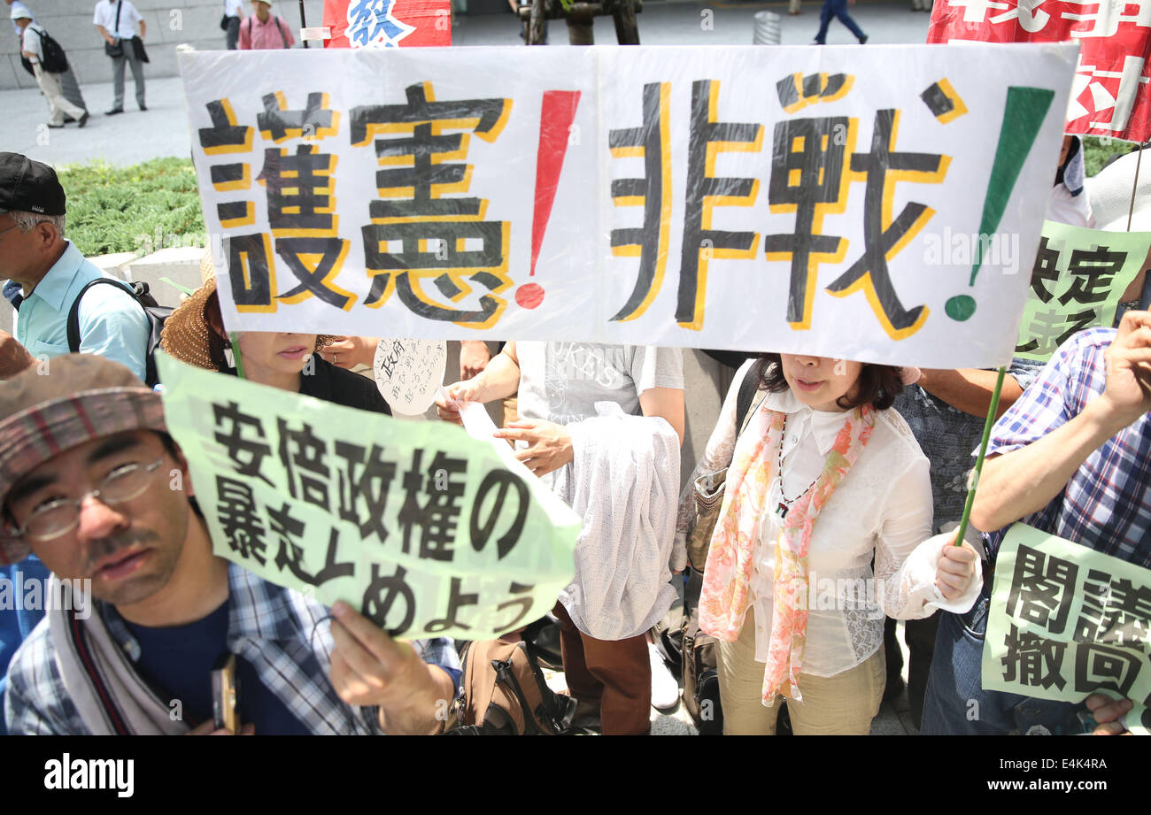 Tokyo, Japan. 14th July, 2014. People take part in a protest against ...