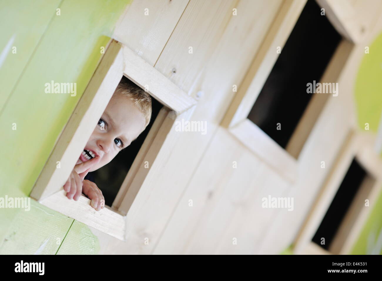 happy child in a window Stock Photo - Alamy
