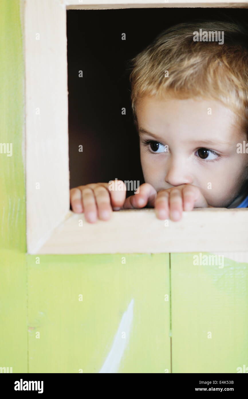 happy child in a window Stock Photo - Alamy