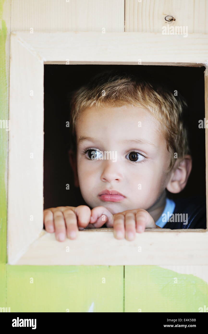 happy child in a window Stock Photo - Alamy