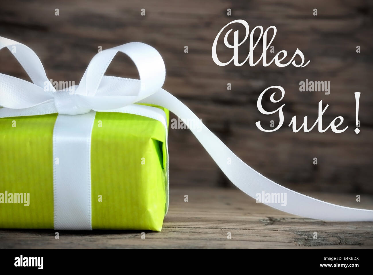 Green Gift with White Decoration and the German Words Alles Gute which ...