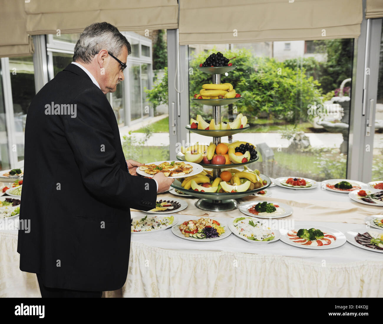 people catering food Stock Photo - Alamy