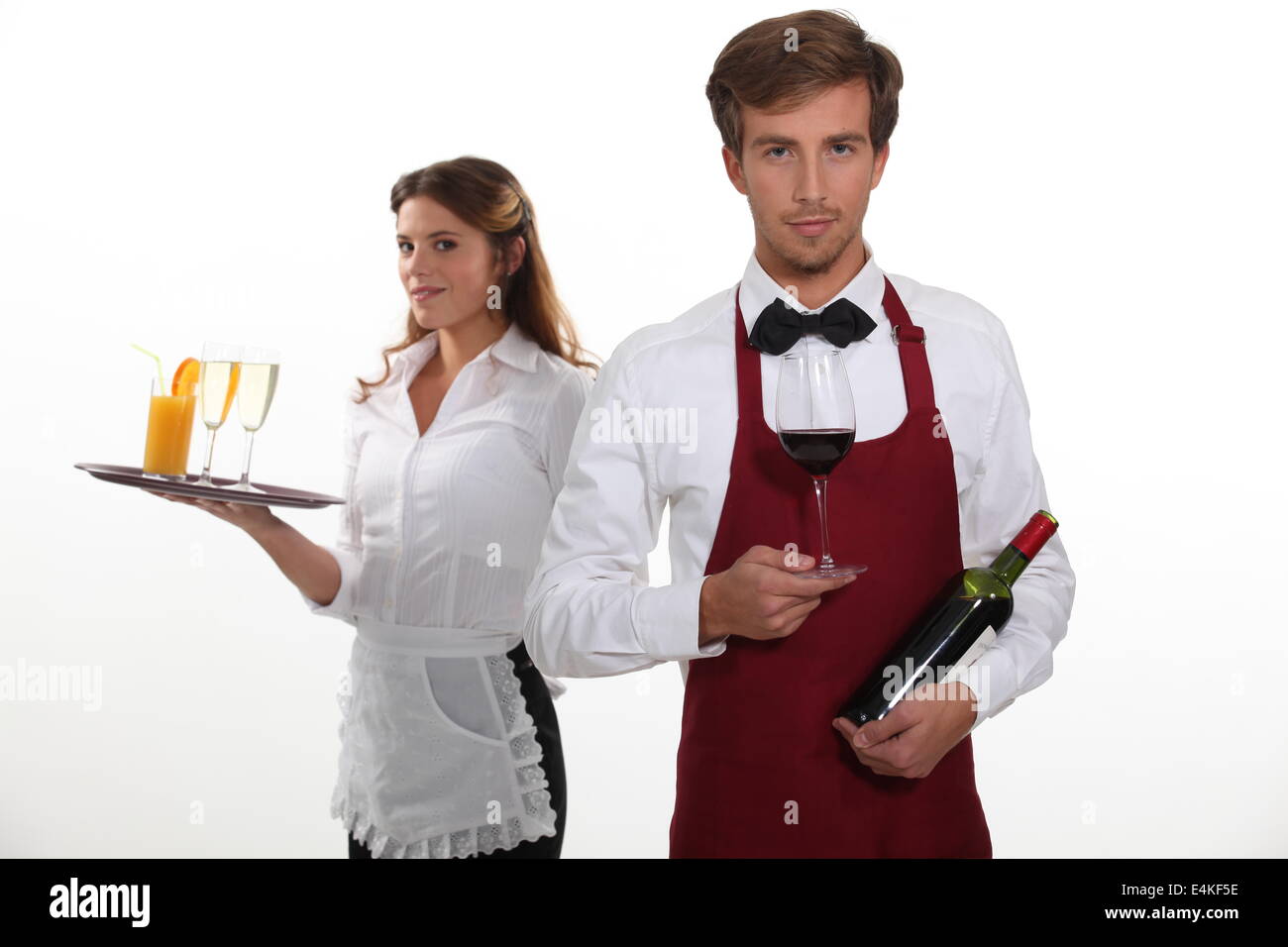 professional waiter and waitress Stock Photo - Alamy