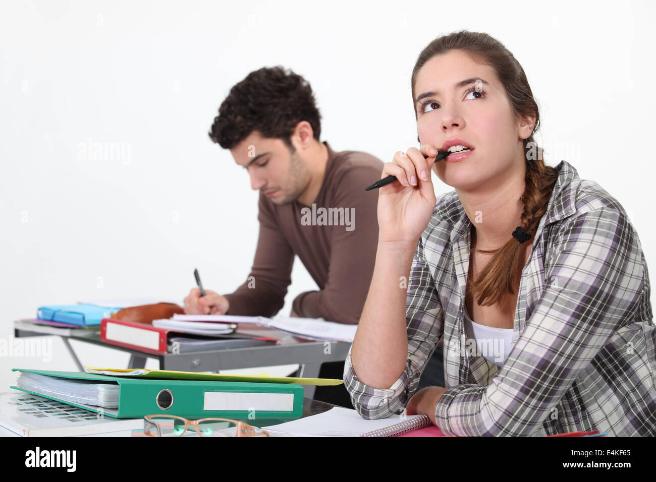 Students working at desks Stock Photo - Alamy