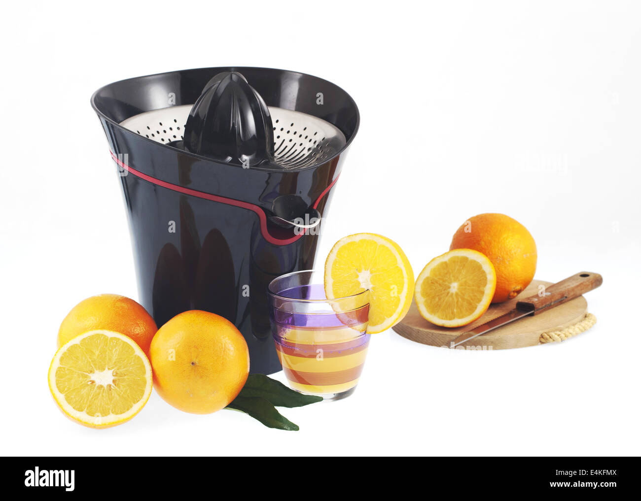 Glass of orange juice with squeezer Cut Out Stock Images & Pictures - Alamy