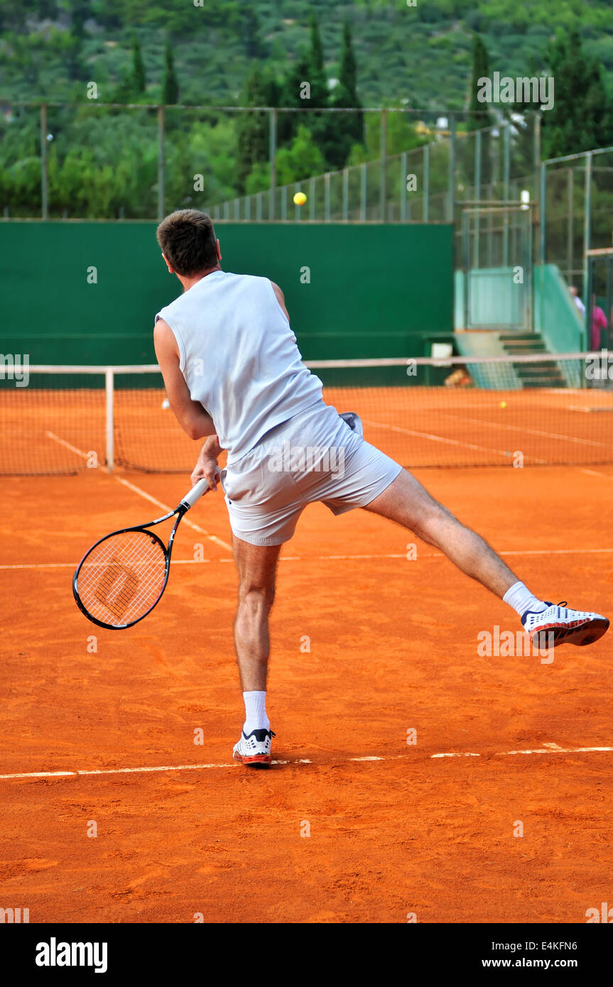 One man play tennis outdoors Stock Photo - Alamy
