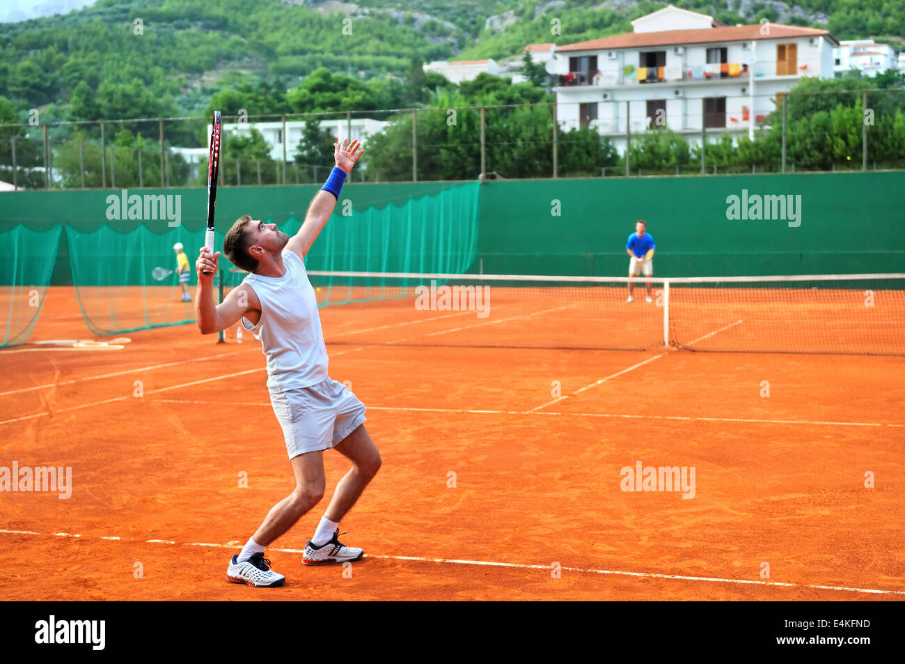 One man play tennis outdoors Stock Photo - Alamy