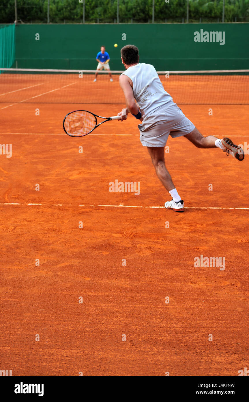 One man play tennis outdoors Stock Photo - Alamy