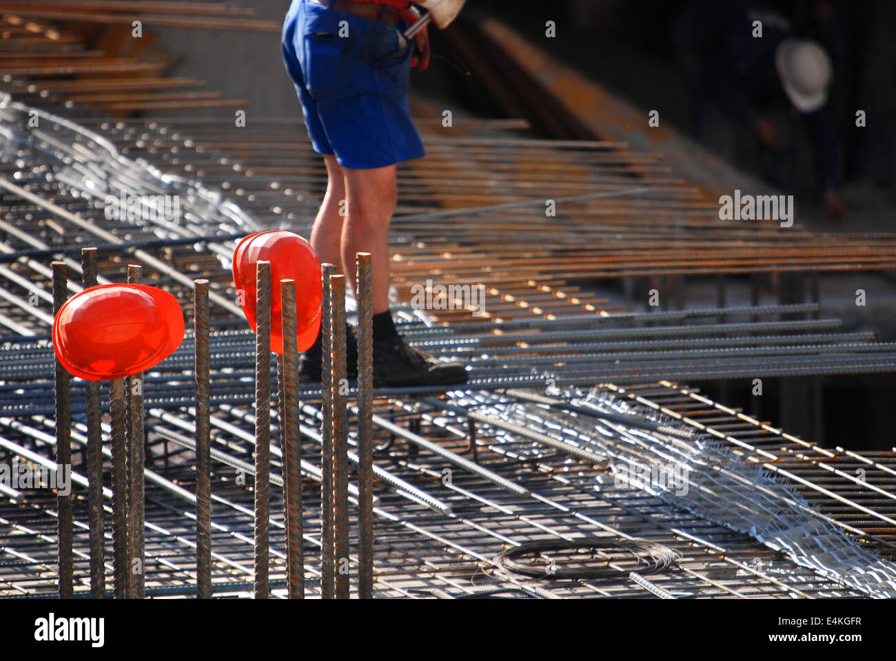 red helmet on construction site Stock Photo - Alamy