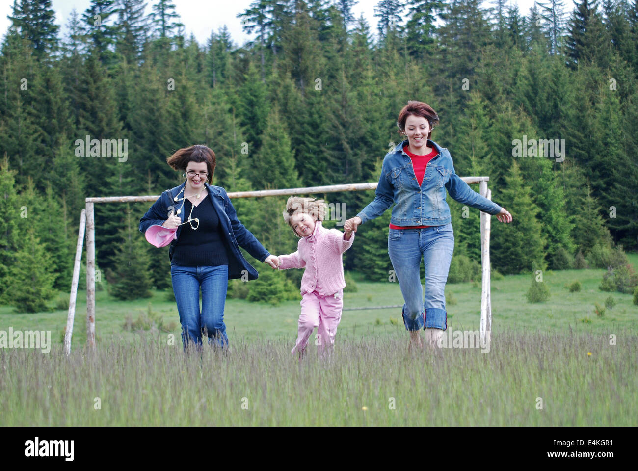 happy girls running in nature Stock Photo - Alamy