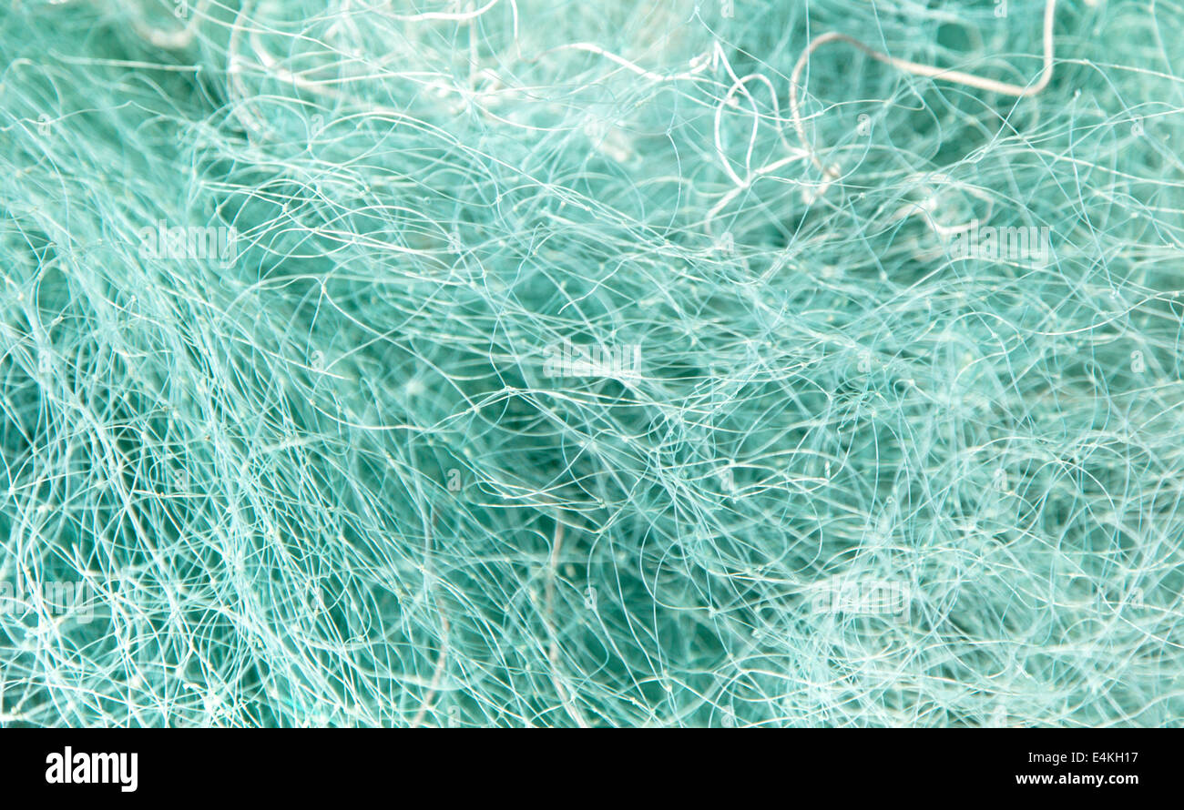 Thin messy fishing nets background Stock Photo - Alamy