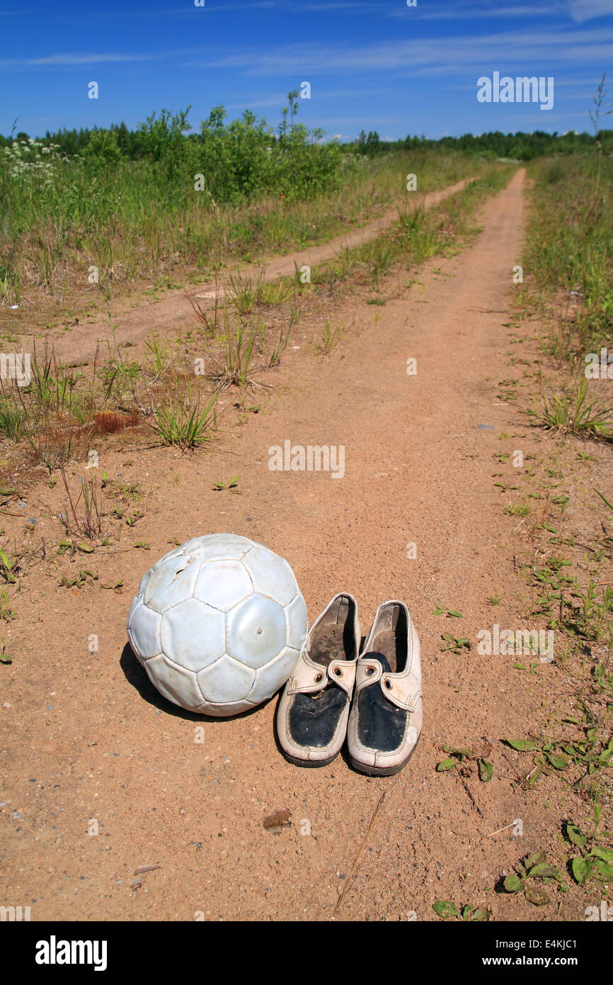 shabby shoe on rural road Stock Photo - Alamy