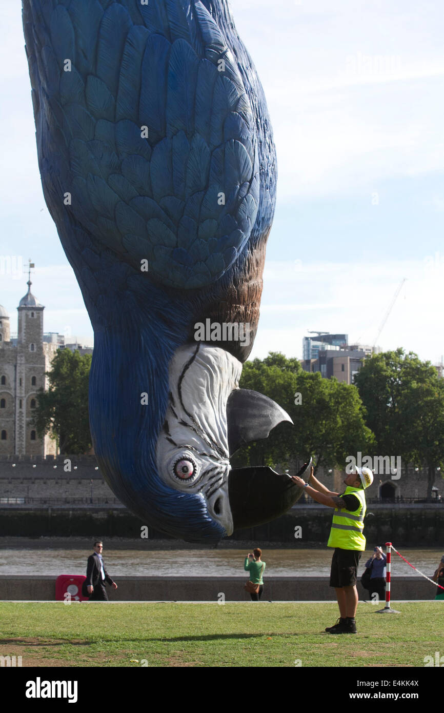 London, UK. 14th July, 2014. A giant sculpture of a dead blue parrot ...