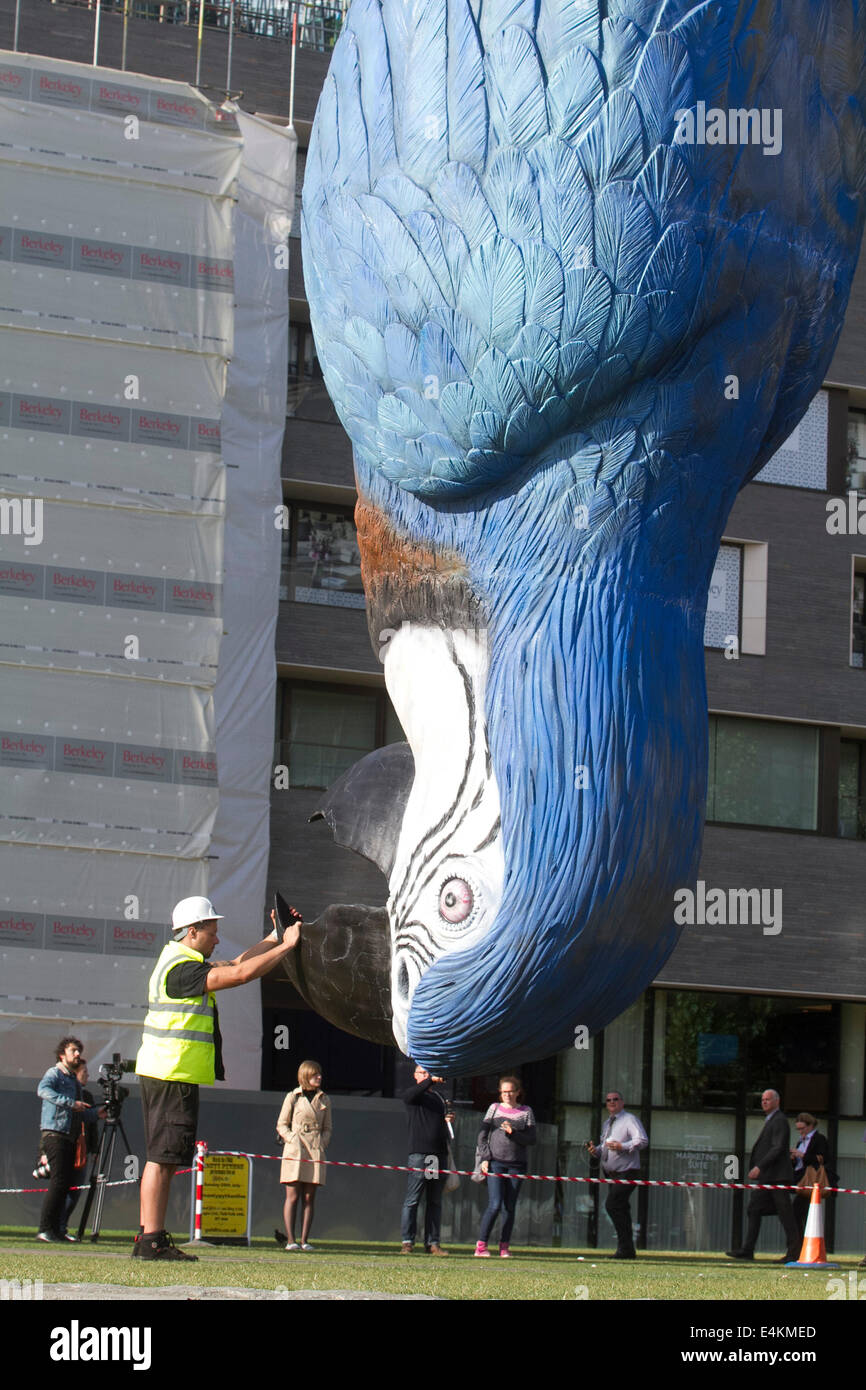 London, UK. 14th July, 2014. A giant sculpture of a dead blue parrot ...