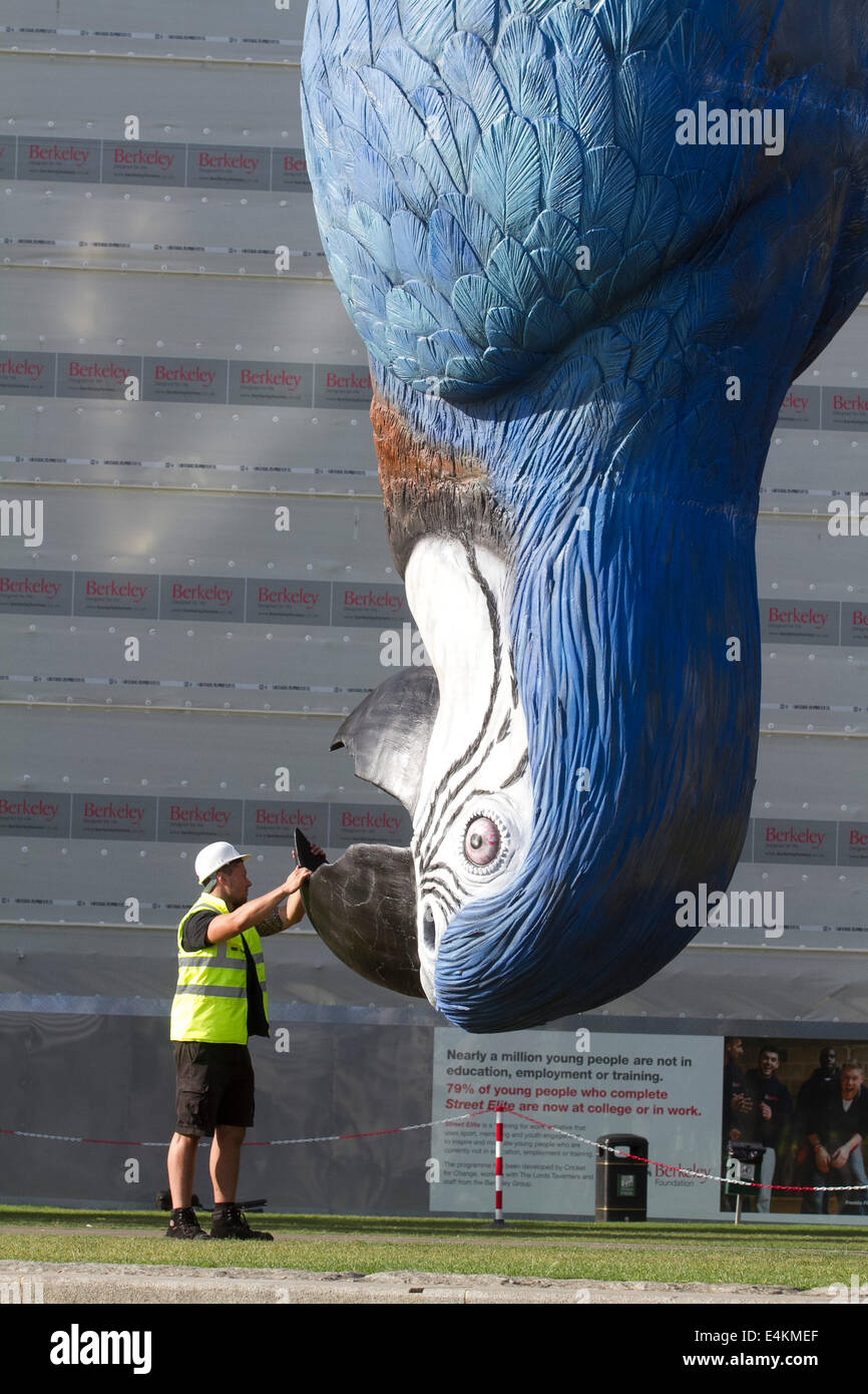 London, UK. 14th July, 2014. A giant sculpture of a dead blue parrot ...