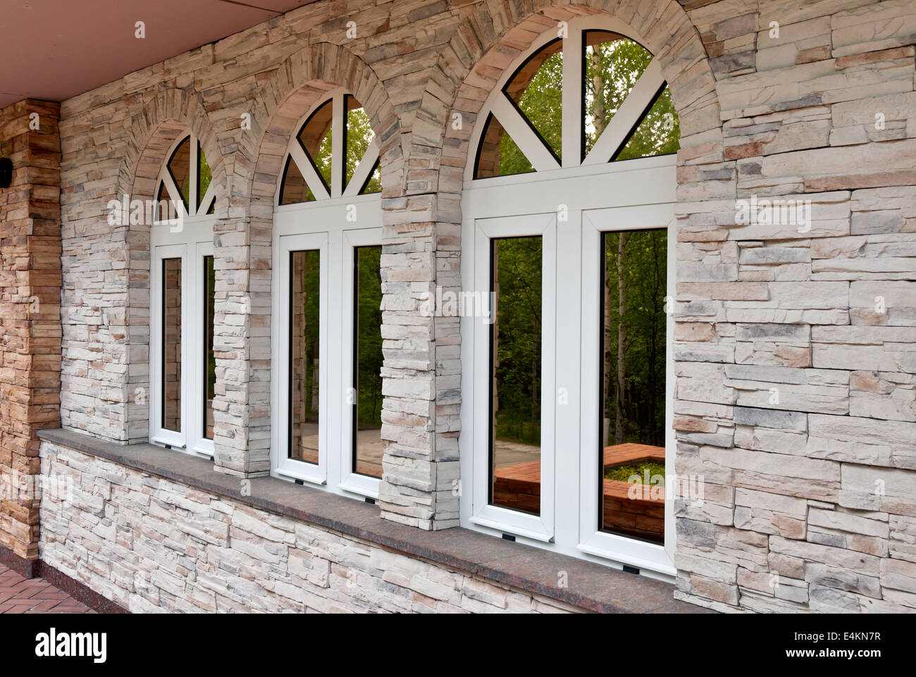 Three windows in the stone wall Stock Photo - Alamy