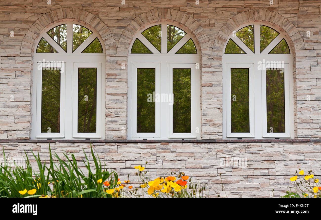 Three windows in the stone wall Stock Photo - Alamy